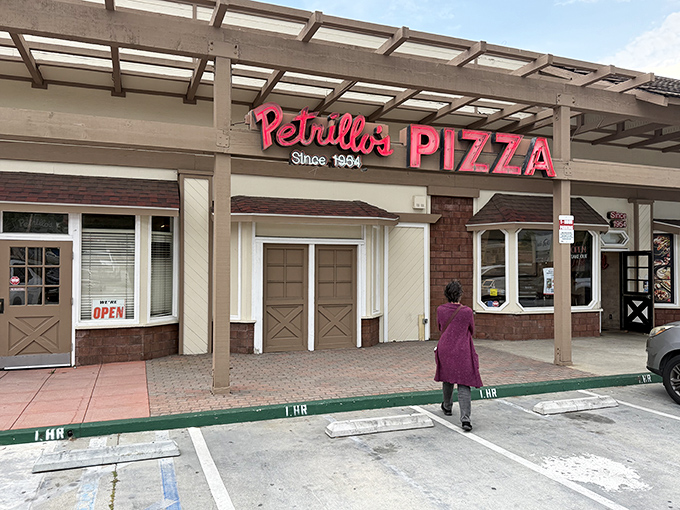 The iconic red sign beckons like a lighthouse for the pizza-obsessed. Since 1954, this Glendora institution has been proving that sometimes the best things don't change.