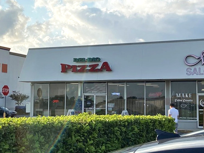 The unassuming storefront that houses pizza greatness. Like Clark Kent's glasses, this modest exterior conceals superhero-level Italian food inside.