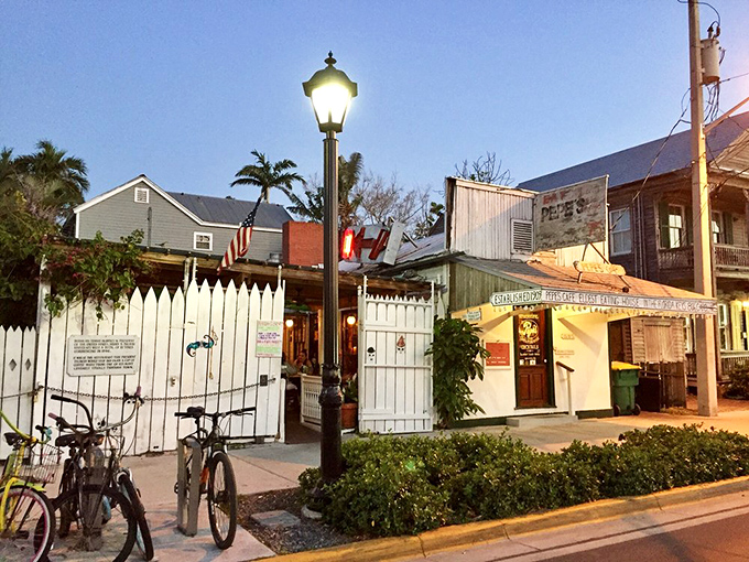 The white picket fence and vintage lamp post aren't just charming decor&mdash;they're time machines to Old Florida, where bicycles outnumber BMWs.
