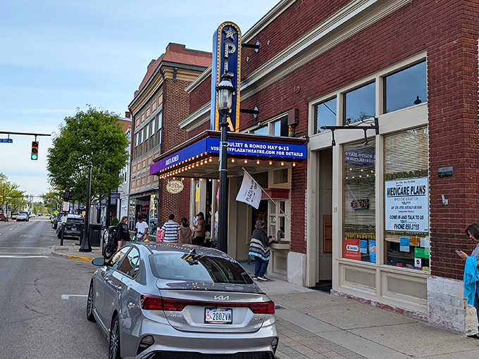 The Plaza's iconic vertical sign beckons cinephiles like a beacon of nostalgia on Miamisburg's Main Street, promising movie magic without modern-day ticket shock.