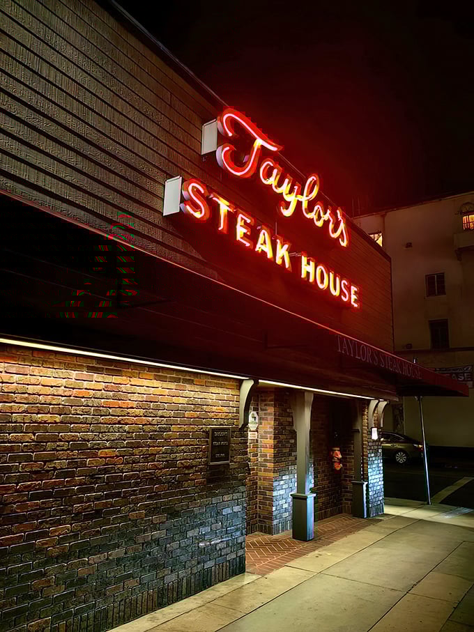 That iconic red neon glow isn't just a sign&mdash;it's a beacon for meat lovers across Los Angeles, promising old-school steakhouse perfection within those brick walls.