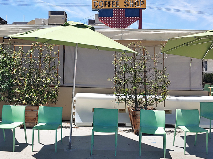 The ivy-covered exterior of 24th Street Cafe stands like a verdant oasis in Bakersfield, its vintage "Coffee Shop" sign promising comfort food treasures within.