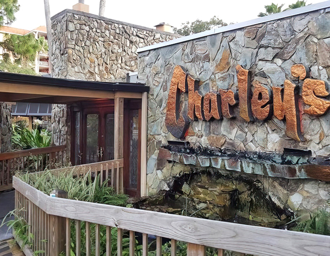 The stone facade of Charley's stands like a culinary fortress, promising old-school excellence behind those wooden doors where lobster legends are born.