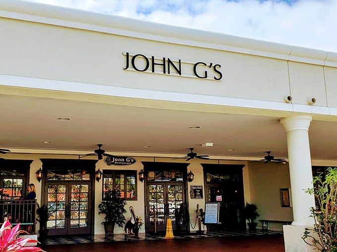 The line forms early at John G's, where patient food pilgrims gather under Florida sunshine. Worth every minute of the wait!