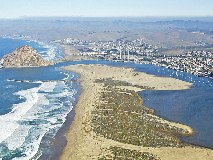 Morro Bay's panoramic splendor unfolds like nature's own IMAX experience, with that iconic rock standing guard over boats dotting the blue harbor.
