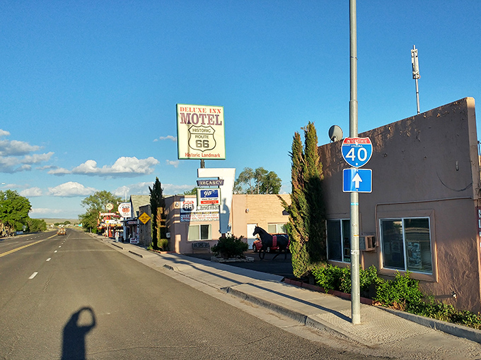Route 66 stretches before you like a ribbon of possibilities, with Seligman's vintage storefronts standing as colorful sentinels of simpler times.