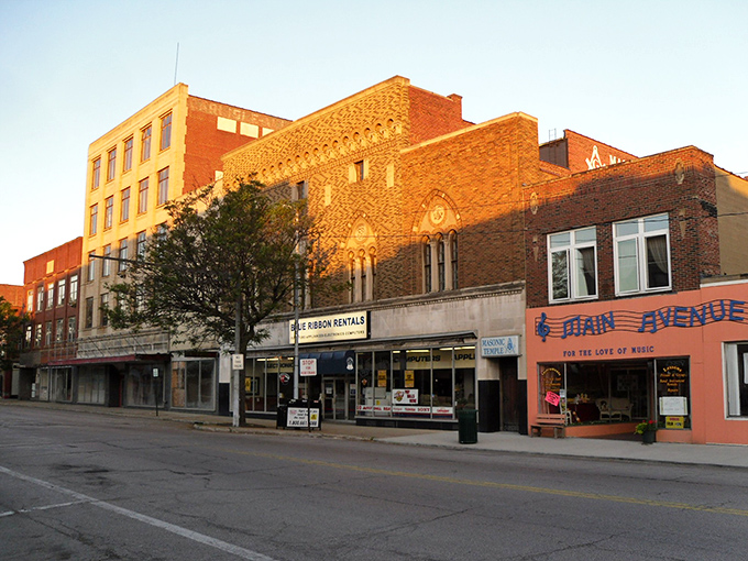 Main Avenue's historic buildings catch the golden hour sunlight, a scene that makes you wonder if Norman Rockwell moonlighted as a city planner.
