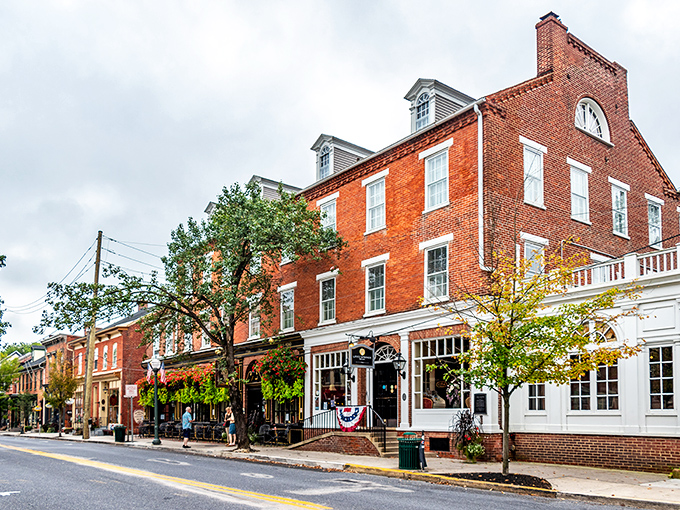 East Main Street beckons with its tree-lined charm and inviting storefronts. Aaron's Books stands ready to transport bibliophiles to literary worlds beyond.