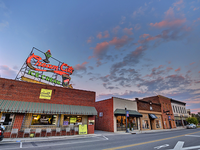 The iconic Cream City Ice Cream sign glows against the twilight sky, a beacon of sweetness that's been drawing locals and visitors alike for generations.