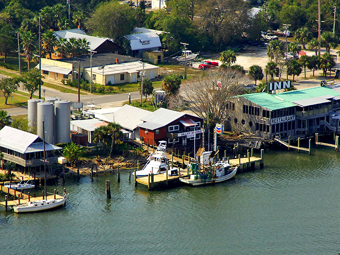 Weathered wooden structures perched over calm waters tell Apalachicola's story better than any brochure &ndash; a working waterfront where authenticity isn't manufactured.