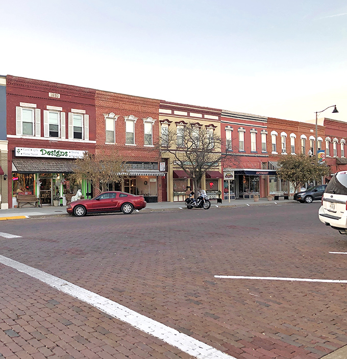 Downtown Lindsborg greets visitors with classic brick buildings, Swedish flags, and that small-town charm that makes you want to cancel your return flight.