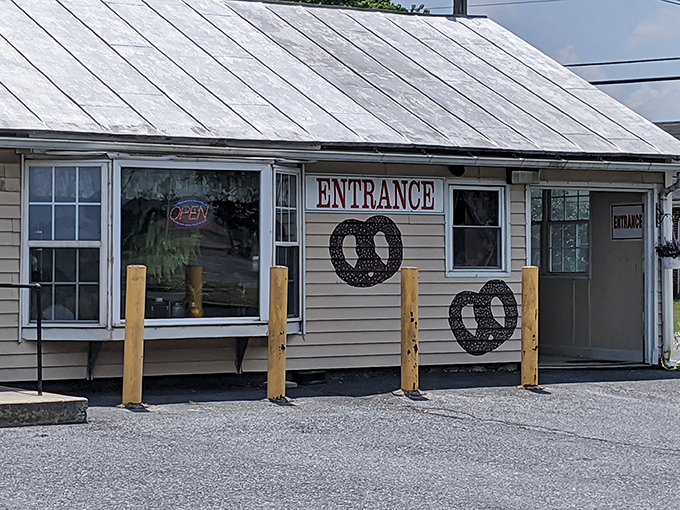 The unassuming white farmhouse exterior of Dutch Country Soft Pretzels stands as Pennsylvania's temple to twisted dough, where pretzel pilgrims have journeyed for decades.