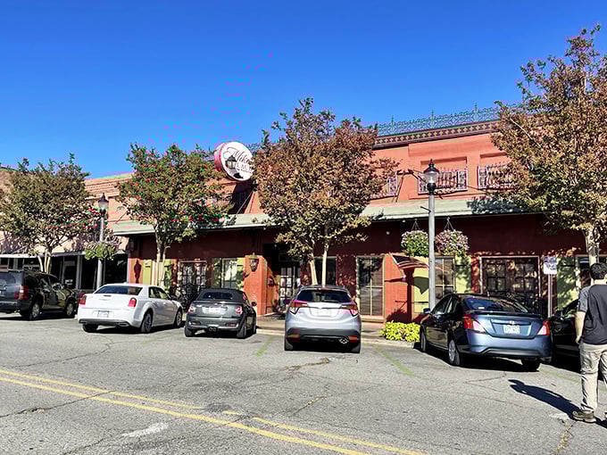 The brick-red exterior of Mike's Place stands as Conway's culinary beacon, its green shutters and vintage sign promising delicious adventures within.