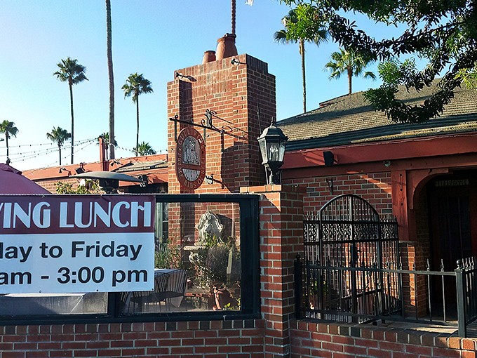 The brick exterior of Gulliver's stands like a time portal to old England, complete with wrought iron fencing and California sunshine playing peekaboo through the trees.