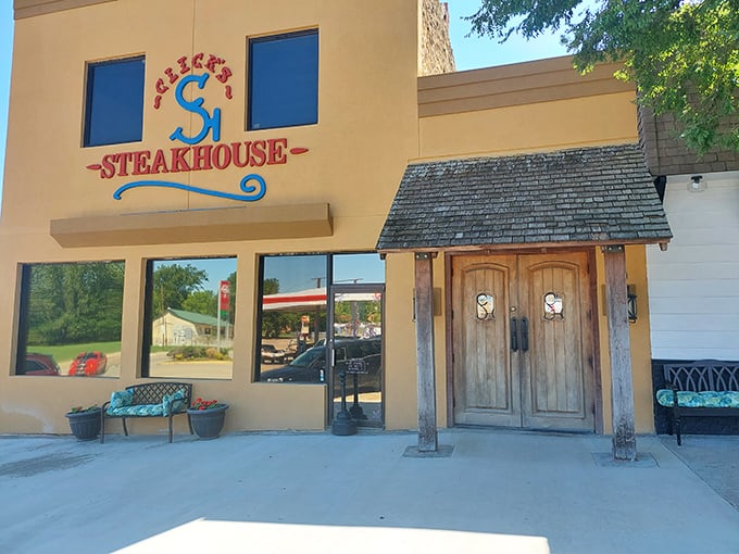 The bright yellow exterior of Click's Steakhouse stands like a beacon of hope for hungry travelers on Oklahoma's highways.