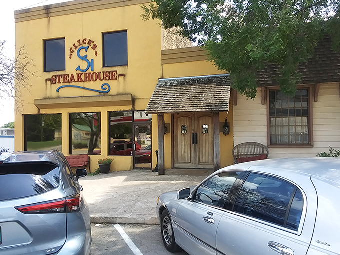 The bright yellow exterior of Click's Steakhouse stands like a beacon of hope for hungry travelers on Oklahoma's highways.