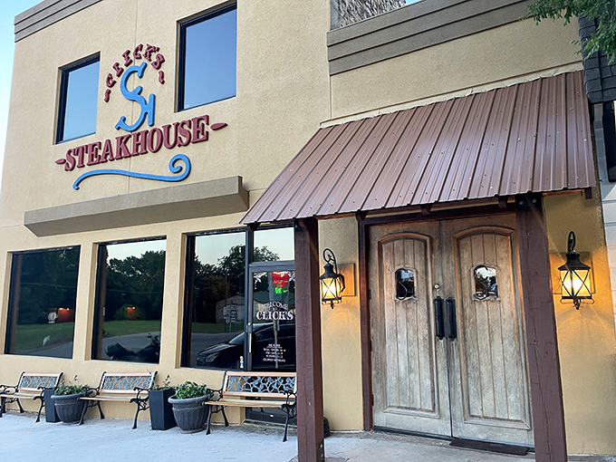 The bright yellow exterior of Click's Steakhouse stands like a beacon of hope for hungry travelers on Oklahoma's highways.