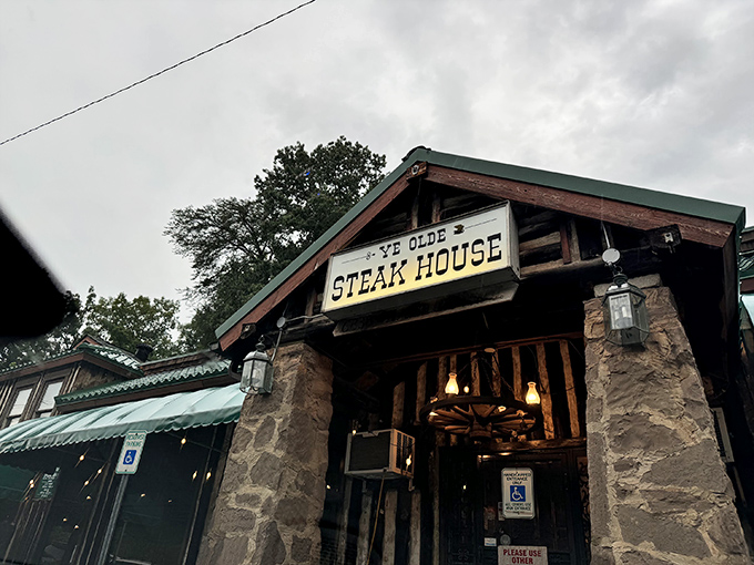 The rustic stone facade of Ye Olde Steak House stands like a carnivore's cathedral, promising meaty salvation to all who enter its hallowed doors.