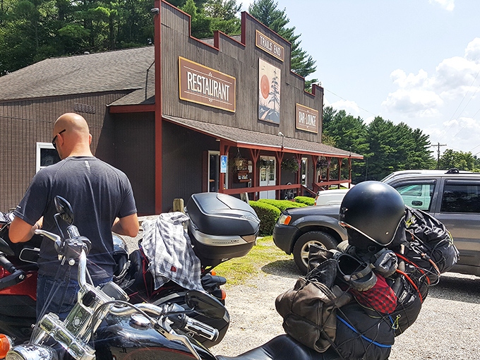 The frontier-style fa&ccedil;ade of Trail's End Restaurant stands proudly against the Pennsylvania sky, its rustic charm beckoning hungry travelers like a culinary lighthouse in the forest.