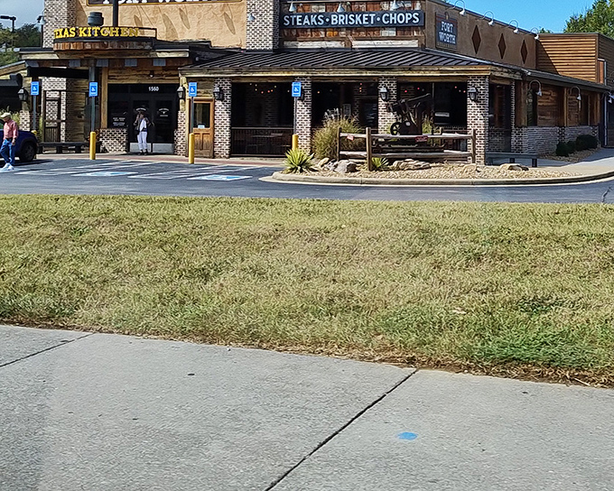 The rustic brick-and-wood exterior of Fort Worth Steakhouse promises authentic Texas flavor without pretense. Meat paradise awaits beyond those doors.