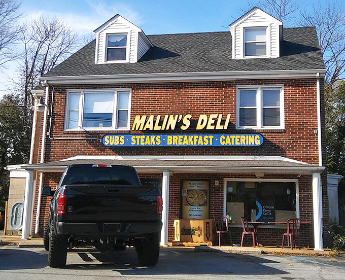 The unassuming brick facade of Malin's Deli stands like a time capsule of authentic American sandwich craftsmanship, proudly waving its flag over Newark's culinary landscape.