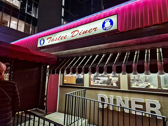 The iconic silver exterior of Tastee Diner stands as a time capsule amid Bethesda's modern landscape, like a chrome-plated guardian of comfort food traditions.