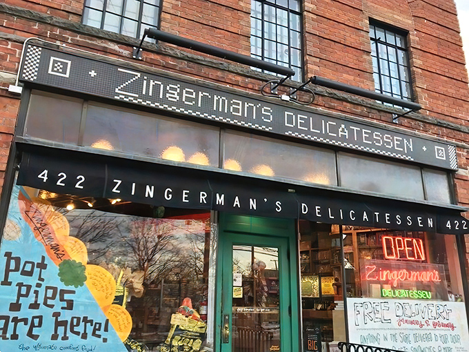 The iconic red brick exterior of Zingerman's stands like a beacon of sandwich salvation on the corner of Detroit and Kingsley Streets in Ann Arbor.