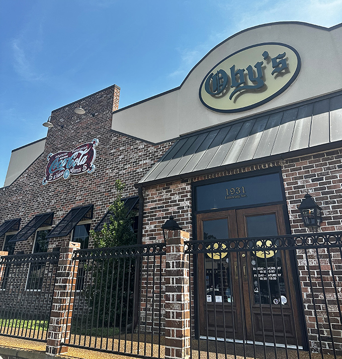 Oby's brick exterior welcomes hungry visitors with its iconic oval sign—like a beacon of sandwich salvation in Oxford's culinary landscape.