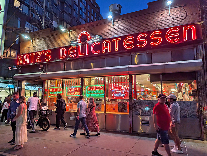 The iconic neon sign of Katz's Delicatessen glows like a beacon for hungry souls on Houston Street, a timeless landmark in a constantly changing city.