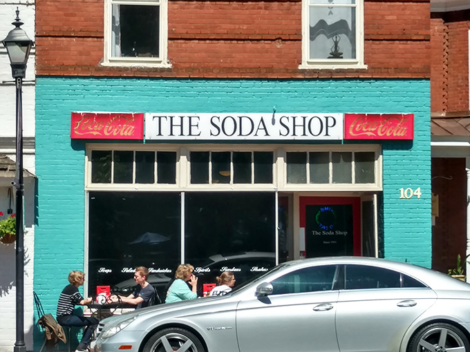 The turquoise facade of The Soda Shop stands out like a nostalgic beacon on Davidson's Main Street, promising comfort and conversation in equal measure.