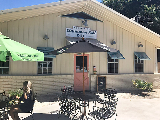 The unassuming beige exterior with its coral-pink door is like that quiet friend who turns out to have the best stories at the party.