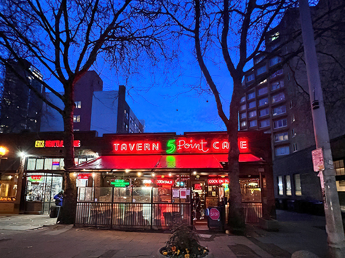 The 5 Point's iconic brick exterior and neon signage beckons like an old friend, promising comfort food and zero pretension in Seattle's bustling Belltown neighborhood.