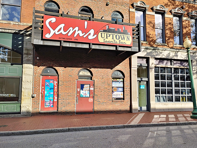 The iconic red sign of Sam's Uptown beckons like a culinary lighthouse on Washington Street, promising good times and even better food in downtown Charleston.