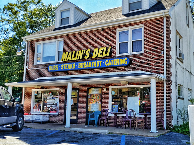 The unassuming brick facade of Malin's Deli stands like a time capsule of authentic American sandwich craftsmanship, proudly waving its flag over Newark's culinary landscape.