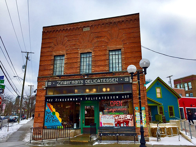 The iconic red brick exterior of Zingerman's stands like a beacon of sandwich salvation on the corner of Detroit and Kingsley Streets in Ann Arbor.