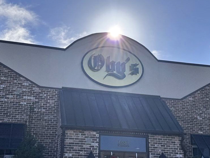 Oby's brick exterior welcomes hungry visitors with its iconic oval sign&mdash;like a beacon of sandwich salvation in Oxford's culinary landscape.