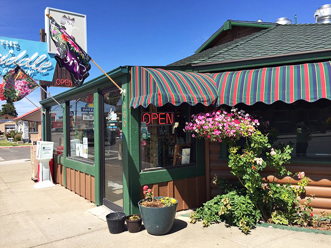 The iconic blue neon sign beckons hungry travelers like a desert oasis. This log cabin diner on Winnemucca's main drag promises comfort food salvation.