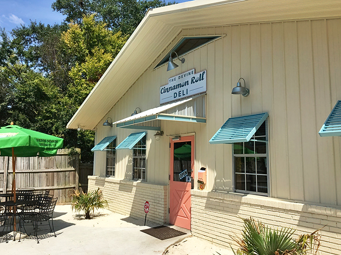 The unassuming beige exterior with its coral-pink door is like that quiet friend who turns out to have the best stories at the party.