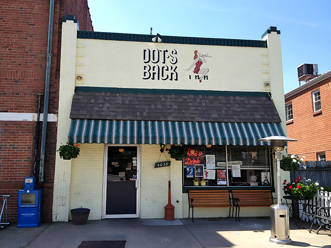 The unassuming white brick exterior of Dot's Back Inn belies the culinary treasures within. Like finding a $20 bill in last year's winter coat—unexpected joy awaits.