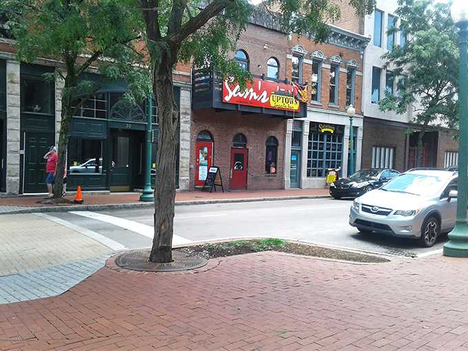 The iconic red sign of Sam's Uptown beckons like a culinary lighthouse on Washington Street, promising good times and even better food in downtown Charleston.
