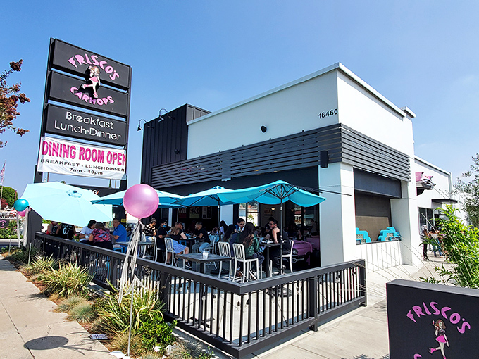 Frisco's sleek exterior blends modern design with retro flair, those pink balloons practically screaming "fun happens here" to everyone driving past.