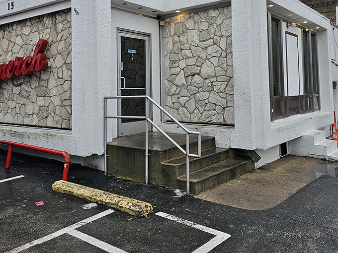 The iconic stone facade of Llanerch Diner stands like a culinary lighthouse, beckoning hungry travelers with its classic red signage and timeless charm.