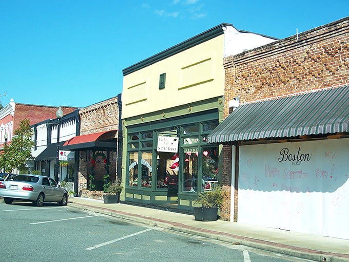 Main Street magic! These colorful storefronts aren't just buildings&mdash;they're time machines disguised as architecture, complete with charming awnings and small-town personality.
