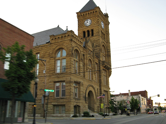 Main Street Americana at its finest – brick storefronts standing shoulder to shoulder like old friends who've weathered decades of small-town stories together.