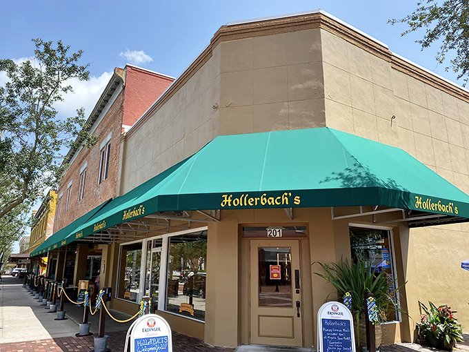 The iconic green awning of Hollerbach's beckons like a portal to Bavaria, standing proudly on 1st Street in historic downtown Sanford.
