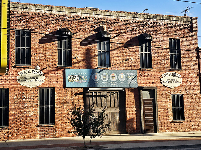 The brick facade and vintage neon sign of Pearl's Crabtown stand as a beacon for seafood lovers in landlocked Oklahoma City. Maritime dreams in Bricktown!