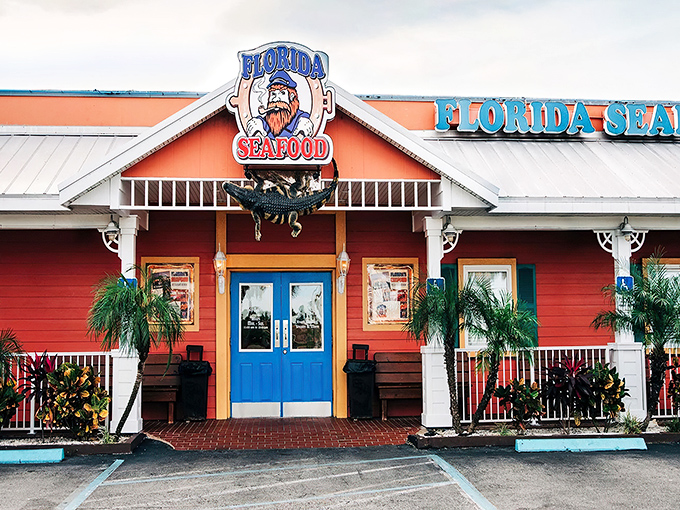 The coral-colored exterior with bright blue doors isn't just eye-catching&mdash;it's practically shouting "Fresh seafood inside!" like a friendly maritime beacon.