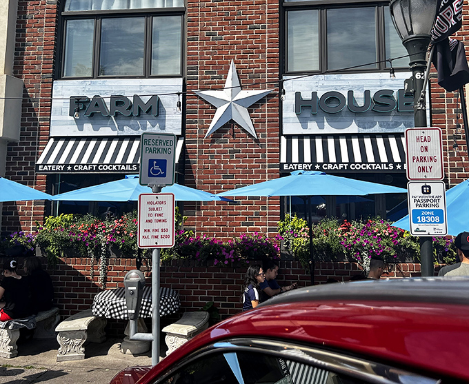 The iconic silver star between "FARM" and "HOUSE" isn't just decoration&mdash;it's a beacon calling hungry travelers to this brick-fronted culinary haven.