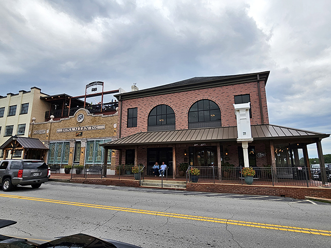 The brick exterior of Bare Bones Steakhouse stands proudly on Buford's Main Street, promising carnivorous delights within those welcoming walls.