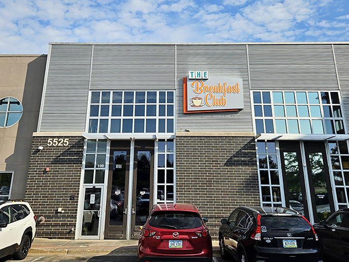 The turquoise-framed sign against rustic brick promises a breakfast revolution hiding behind that unassuming door at 212 East 3rd Street.